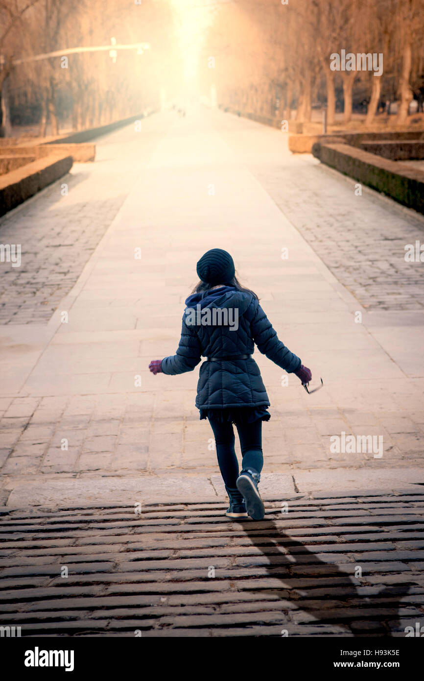 Woman descending stairs hi-res stock photography and images - Alamy