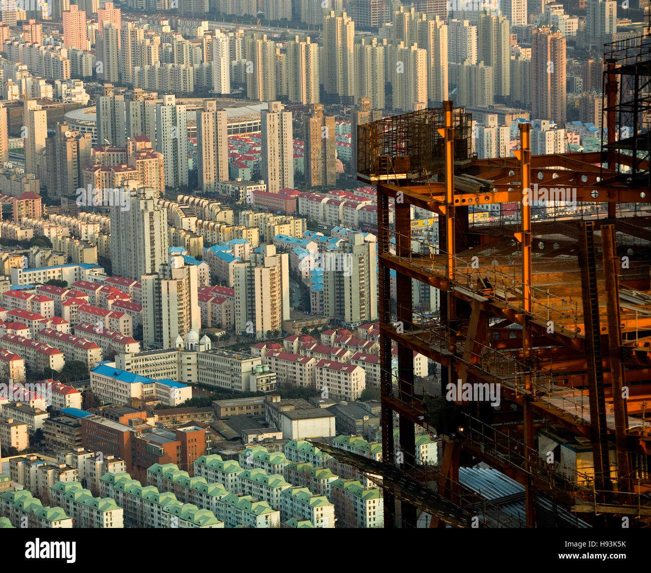 Office building being constructed with dense city in background Stock ...