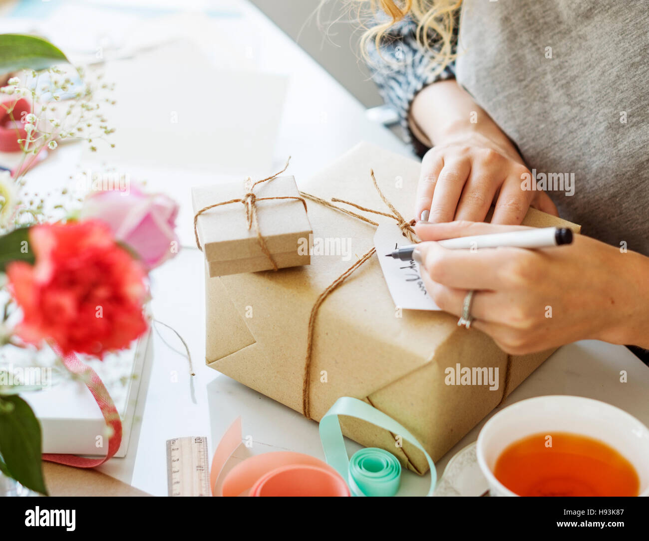 Woman Writing Card Gift Present Concept Stock Photo - Alamy