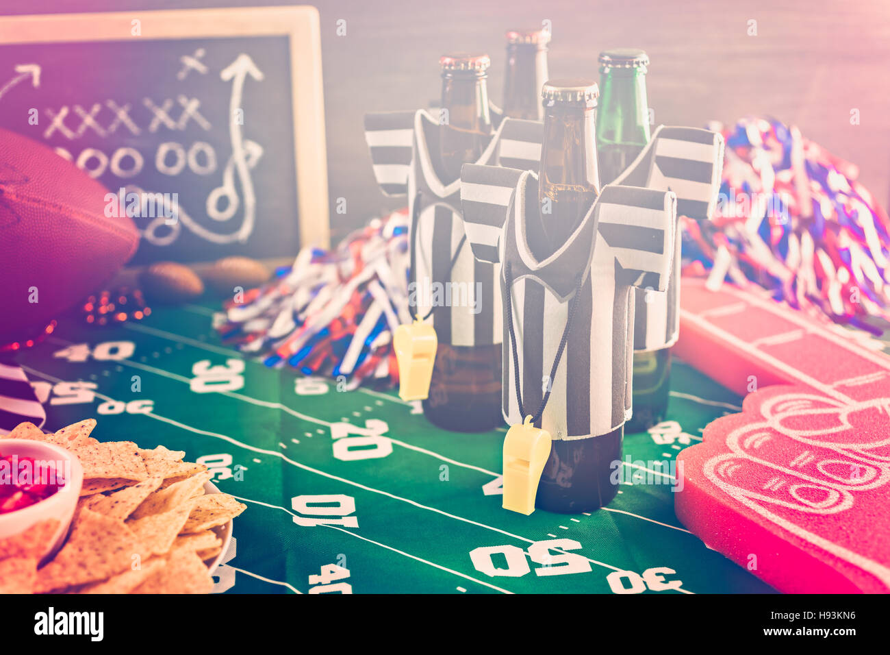 Game day football party table with beer, chips and salsa Stock Photo ...