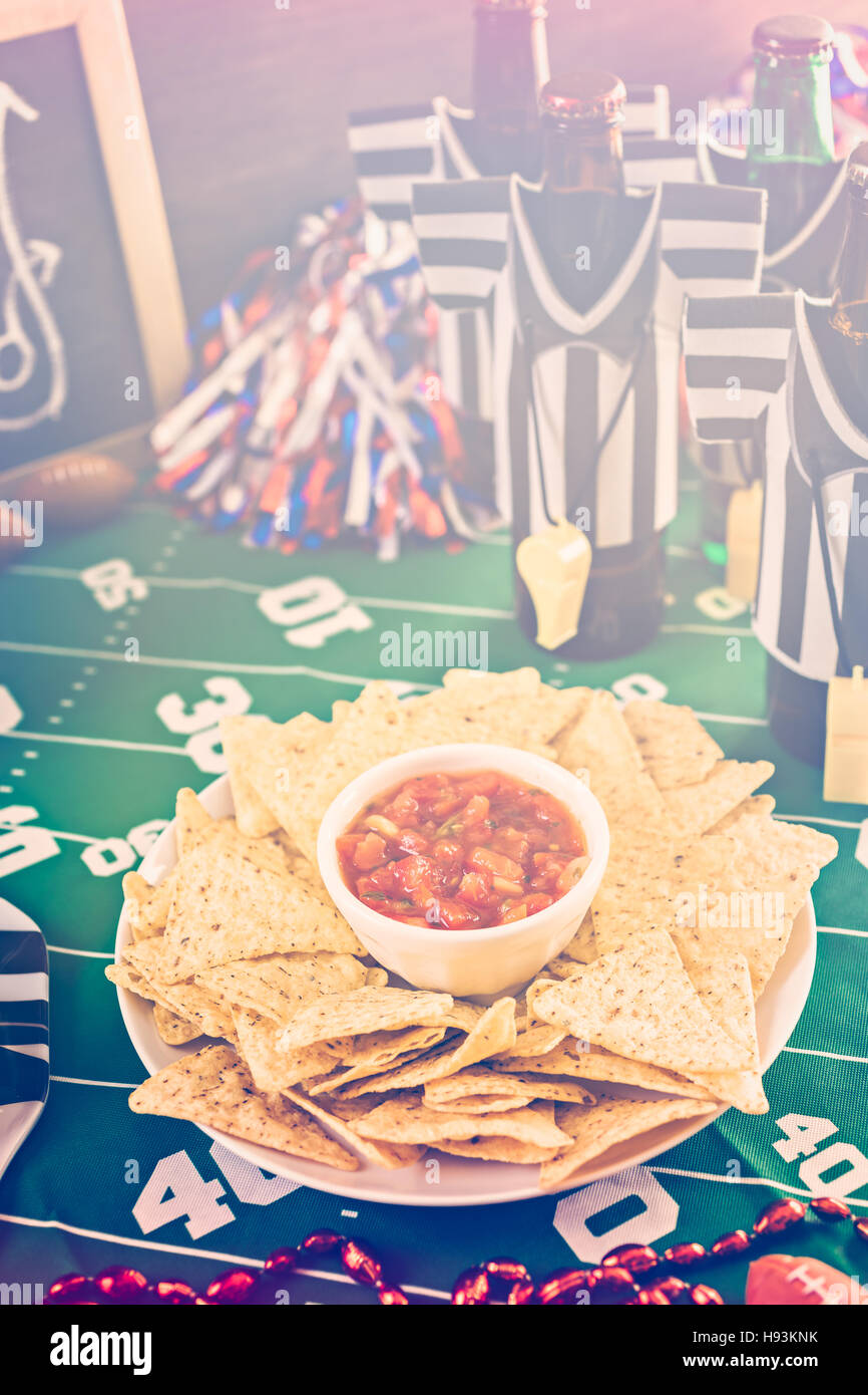 Game day football party table with beer, chips and salsa Stock Photo ...