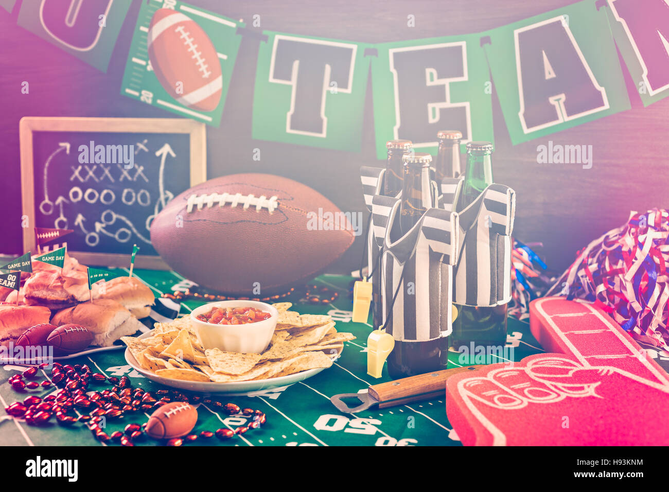 Game day football party table with beer, chips and salsa Stock Photo ...