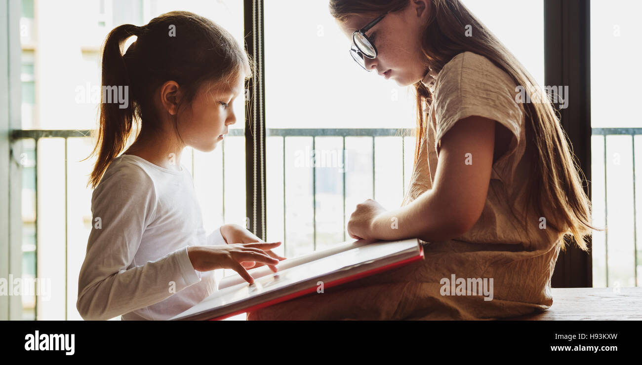 Girls Reading Book Study Concept Stock Photo - Alamy
