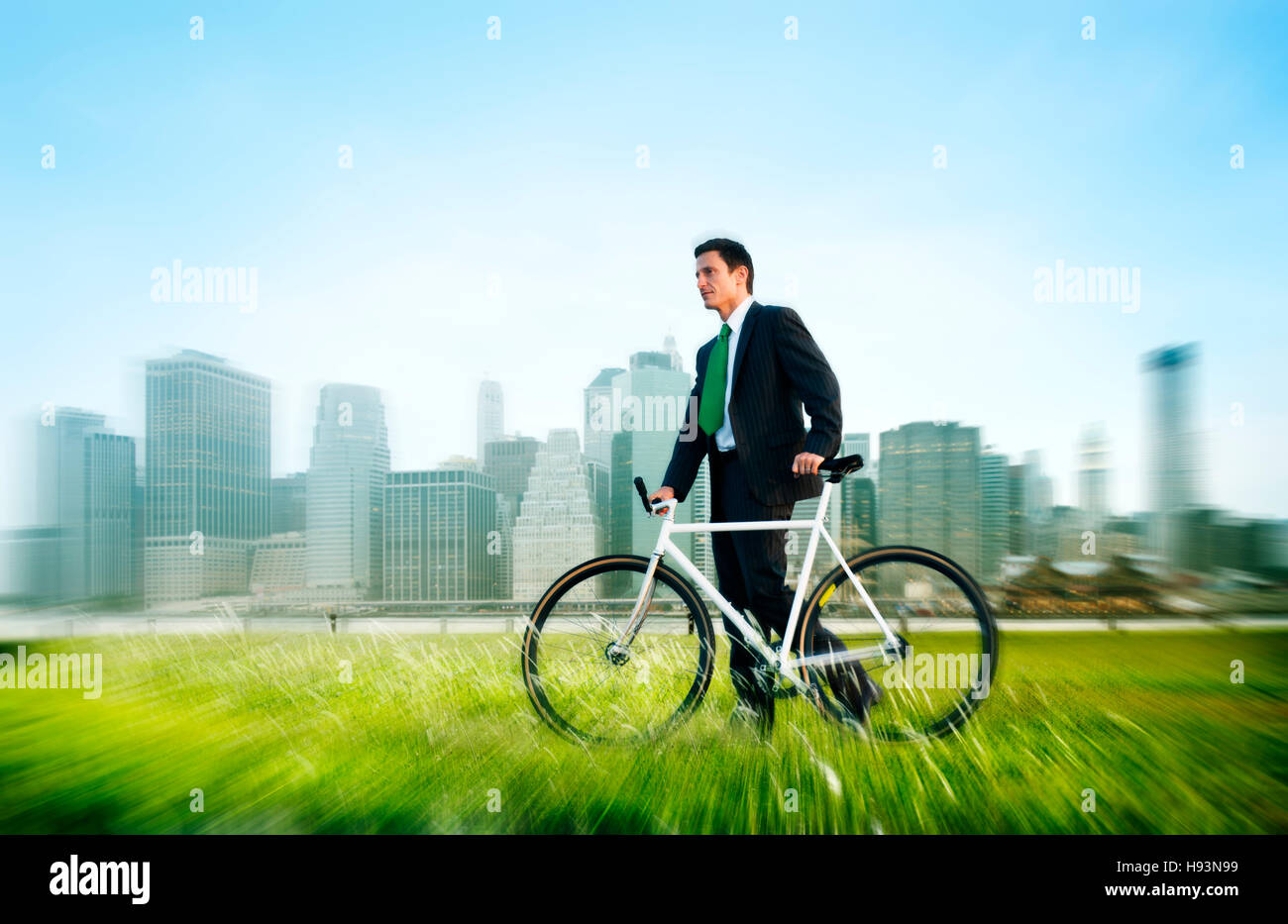 Business Man Pushing Bike Outdoors Concept Stock Photo - Alamy