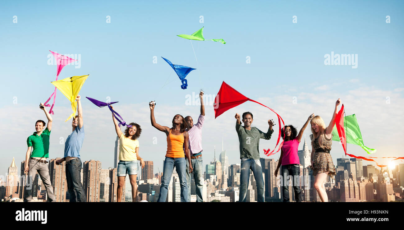 Friends Activity Playing Kite Rooftop Concept Stock Photo - Alamy