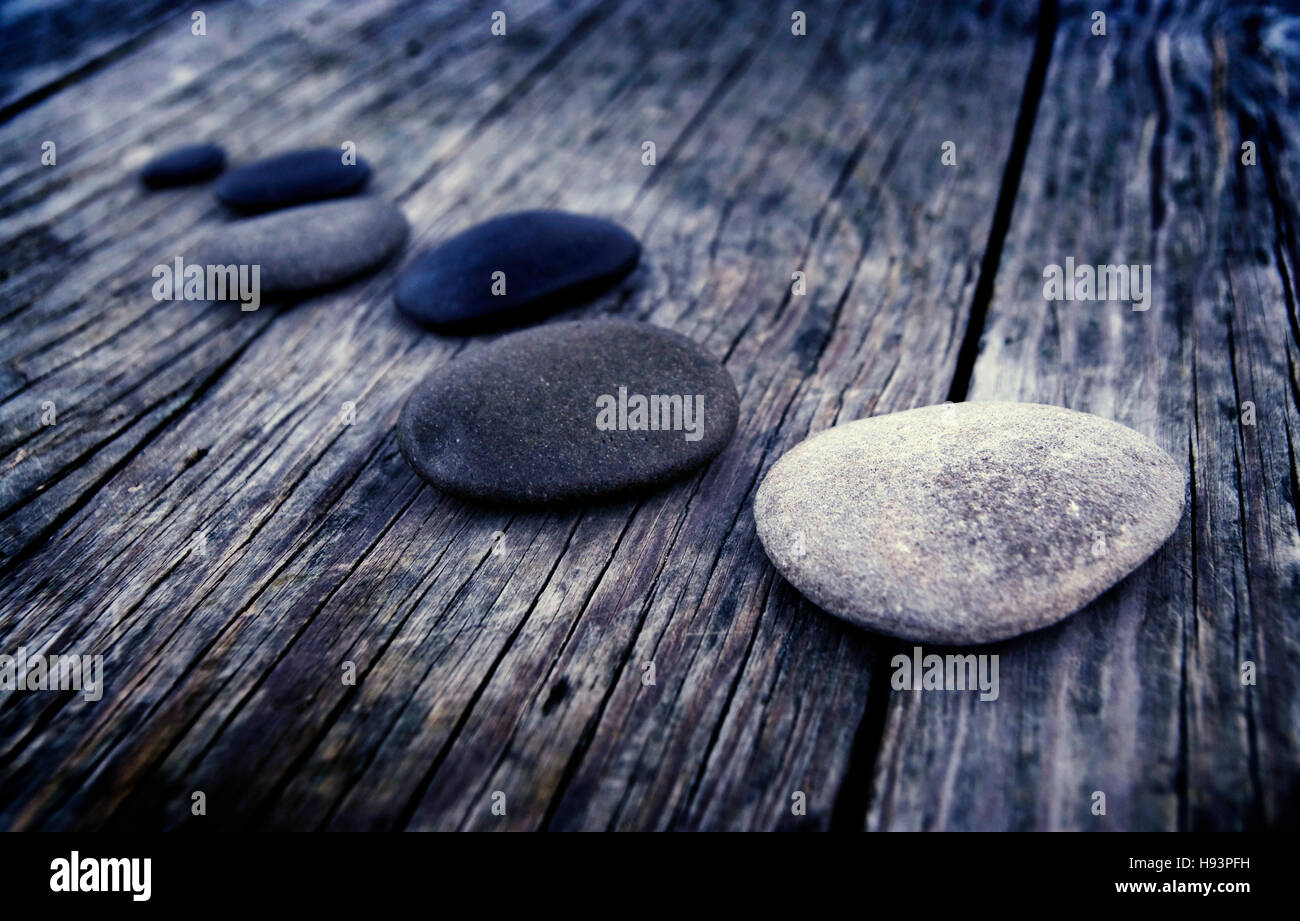 Stones Wooden Table Group of Objects Concept Stock Photo - Alamy
