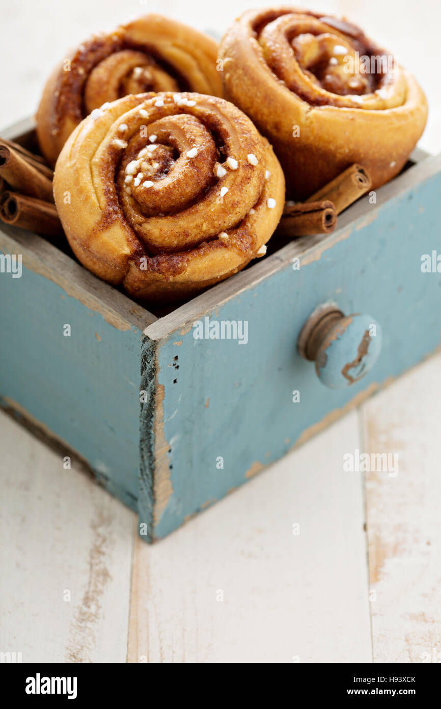 Cinnamon buns in a wooden box Stock Photo - Alamy