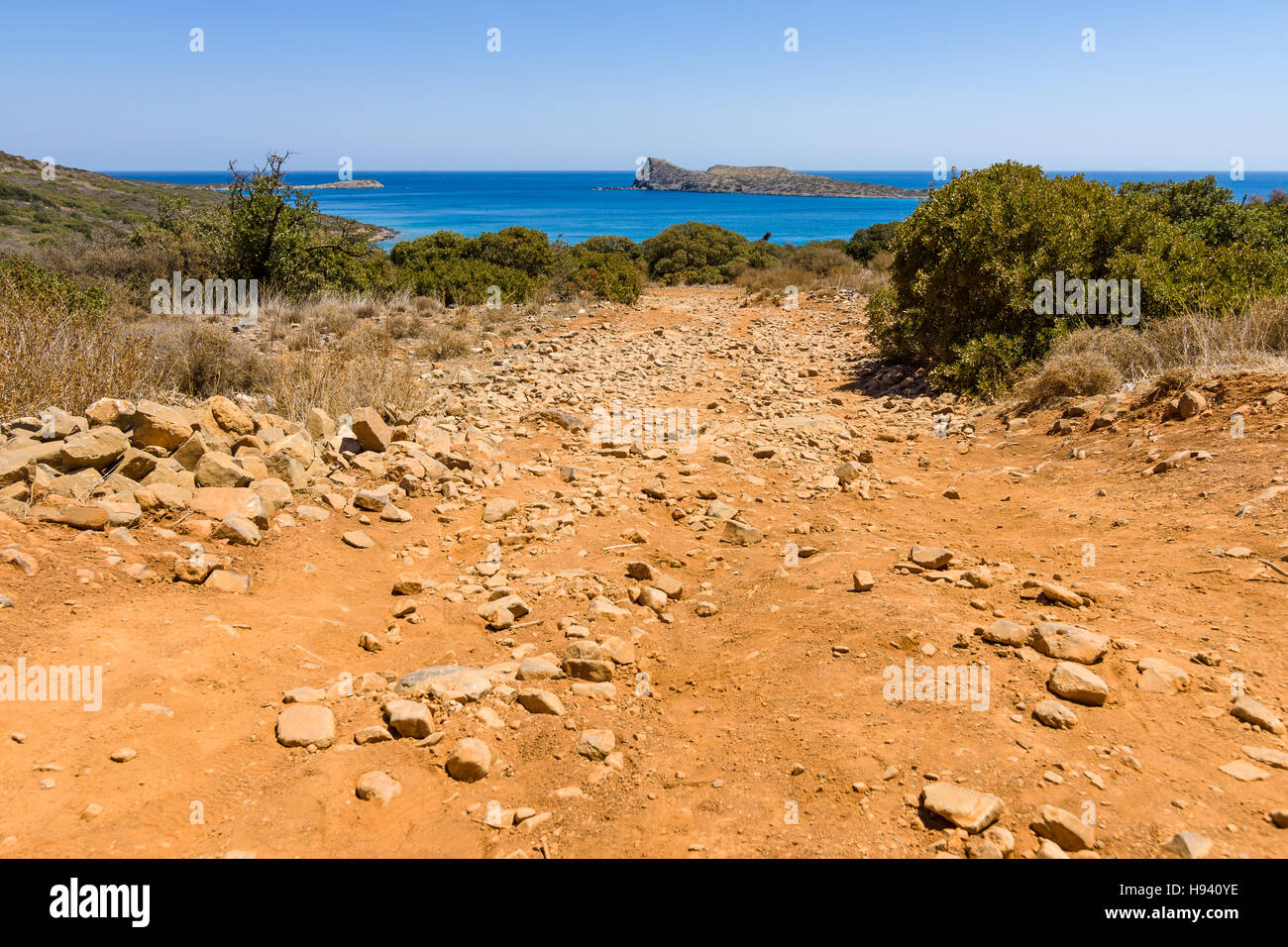 The dirt road strewn with large stones. The peninsula Kalydon. Crete ...