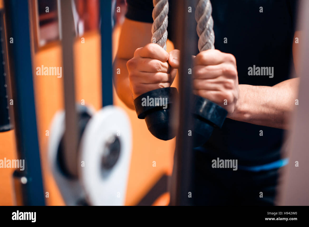 Triceps Exercise With Cables Stock Photo - Alamy