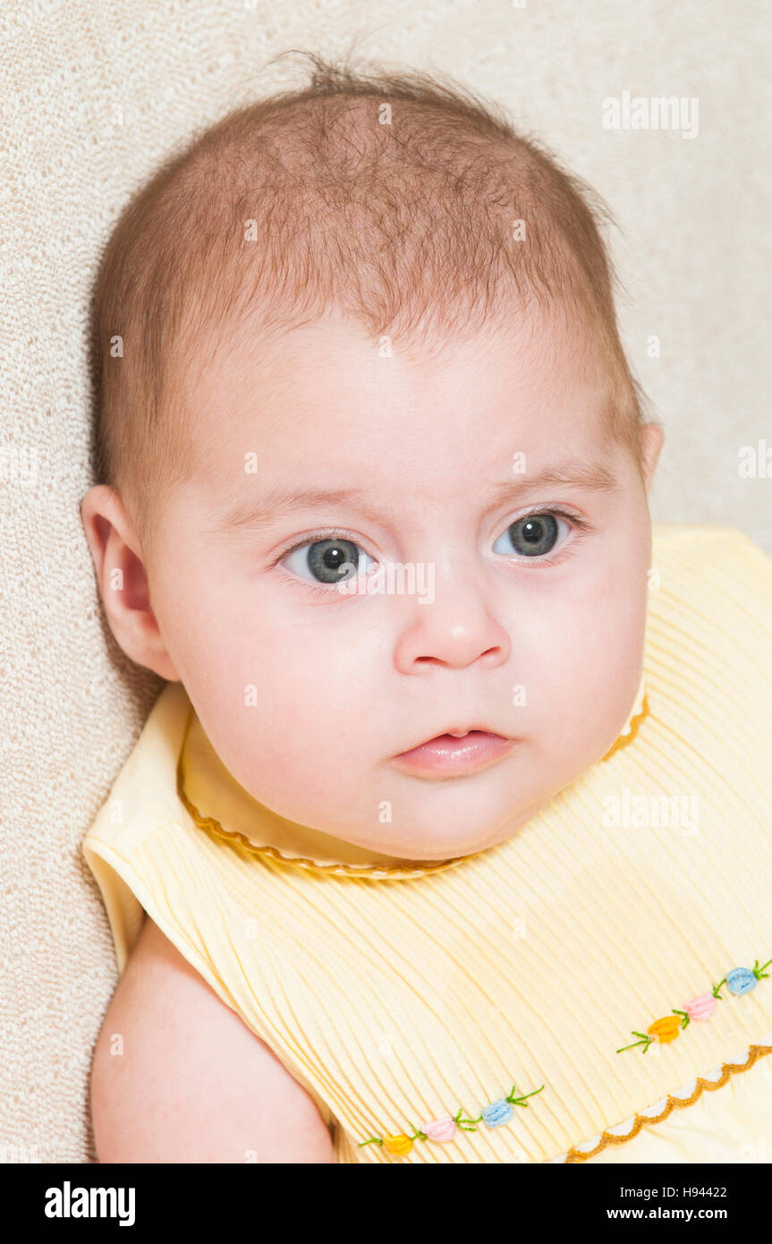 Curious infant girl looking away Stock Photo - Alamy