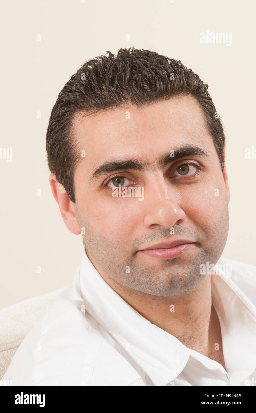 Portrait of a middle eastern man indoors Stock Photo - Alamy