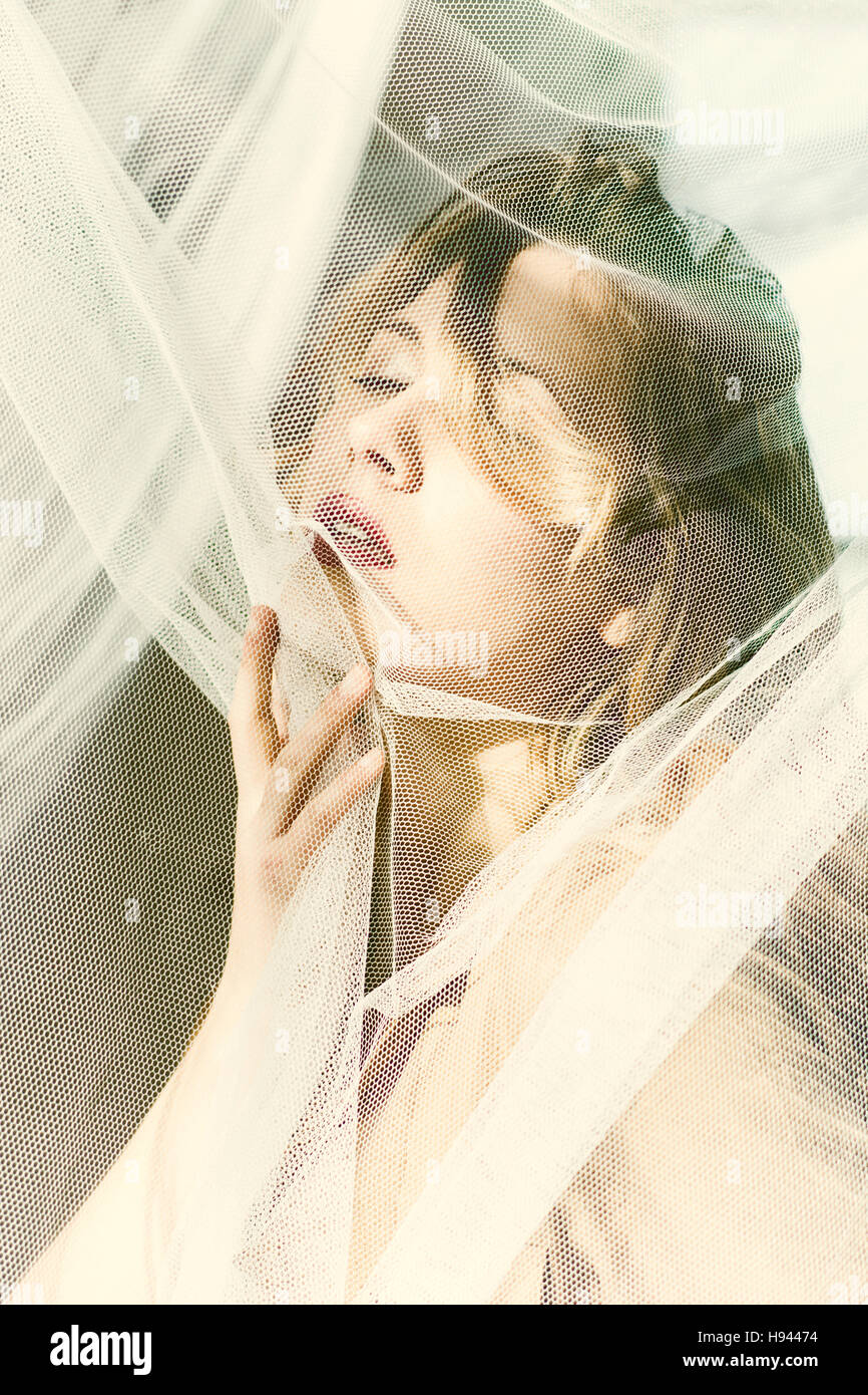 Beautiful young woman hand touching face Stock Photo - Alamy