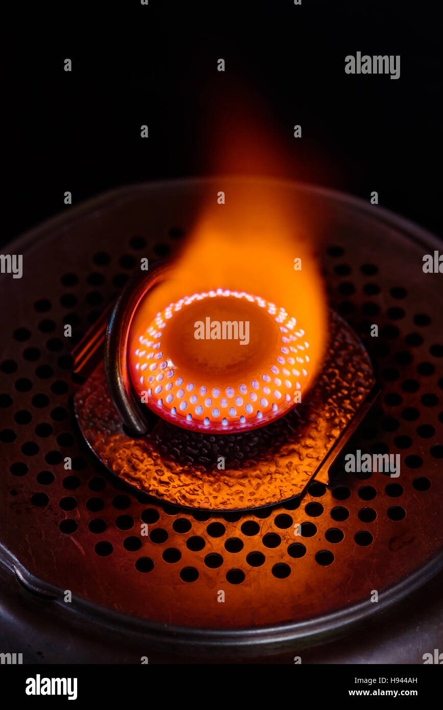 Close up of lightweight camping gas burner with flames Stock Photo - Alamy