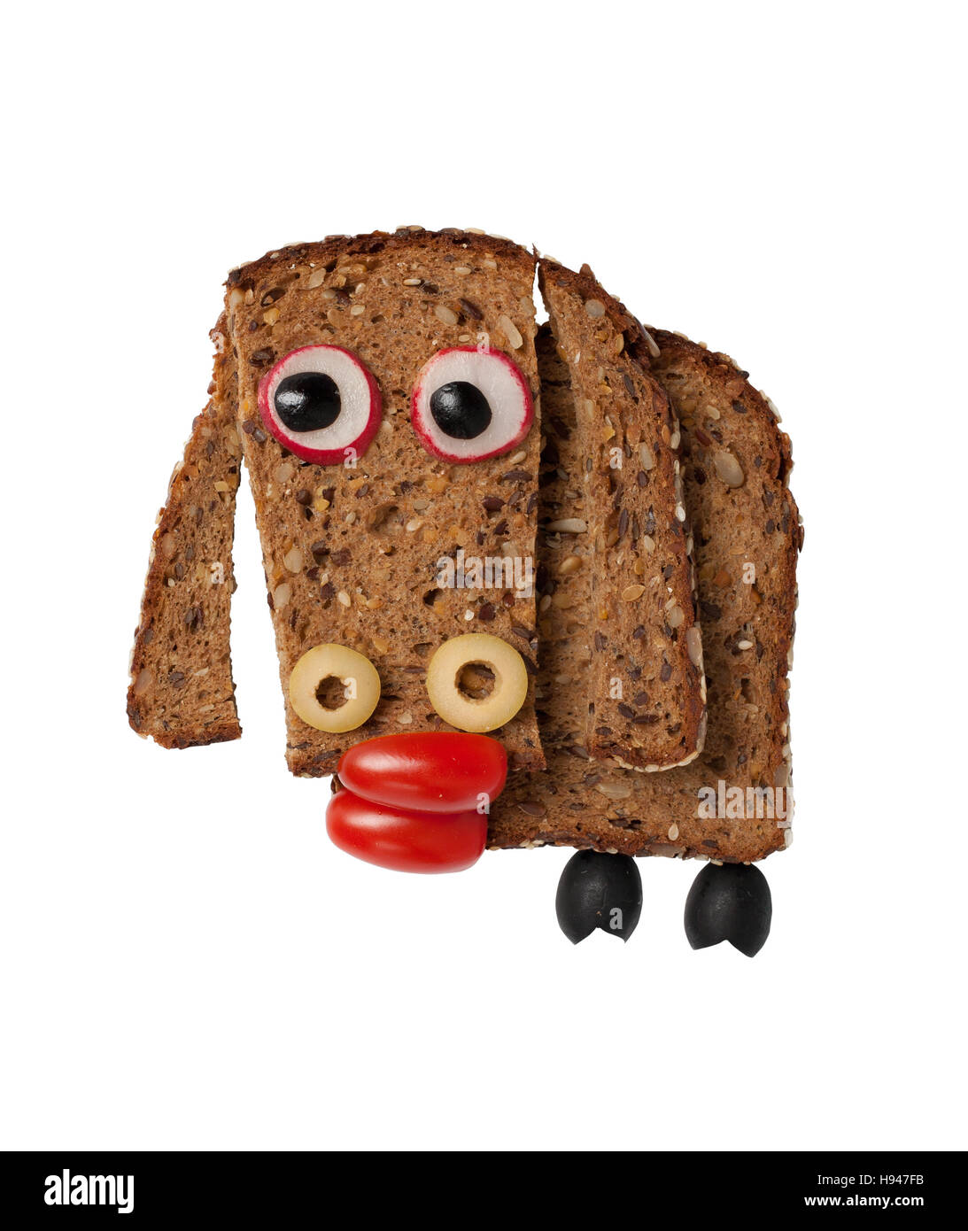 Sheep made of black bread and vegetables on white background Stock ...