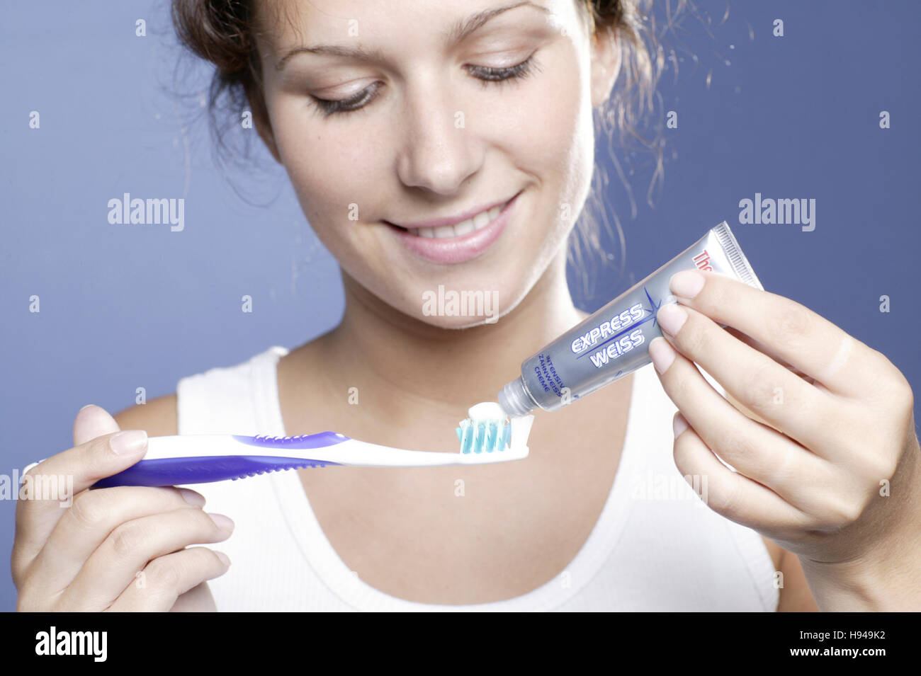 Young woman with toothbrush and toothpaste, whitening-paste Stock Photo ...
