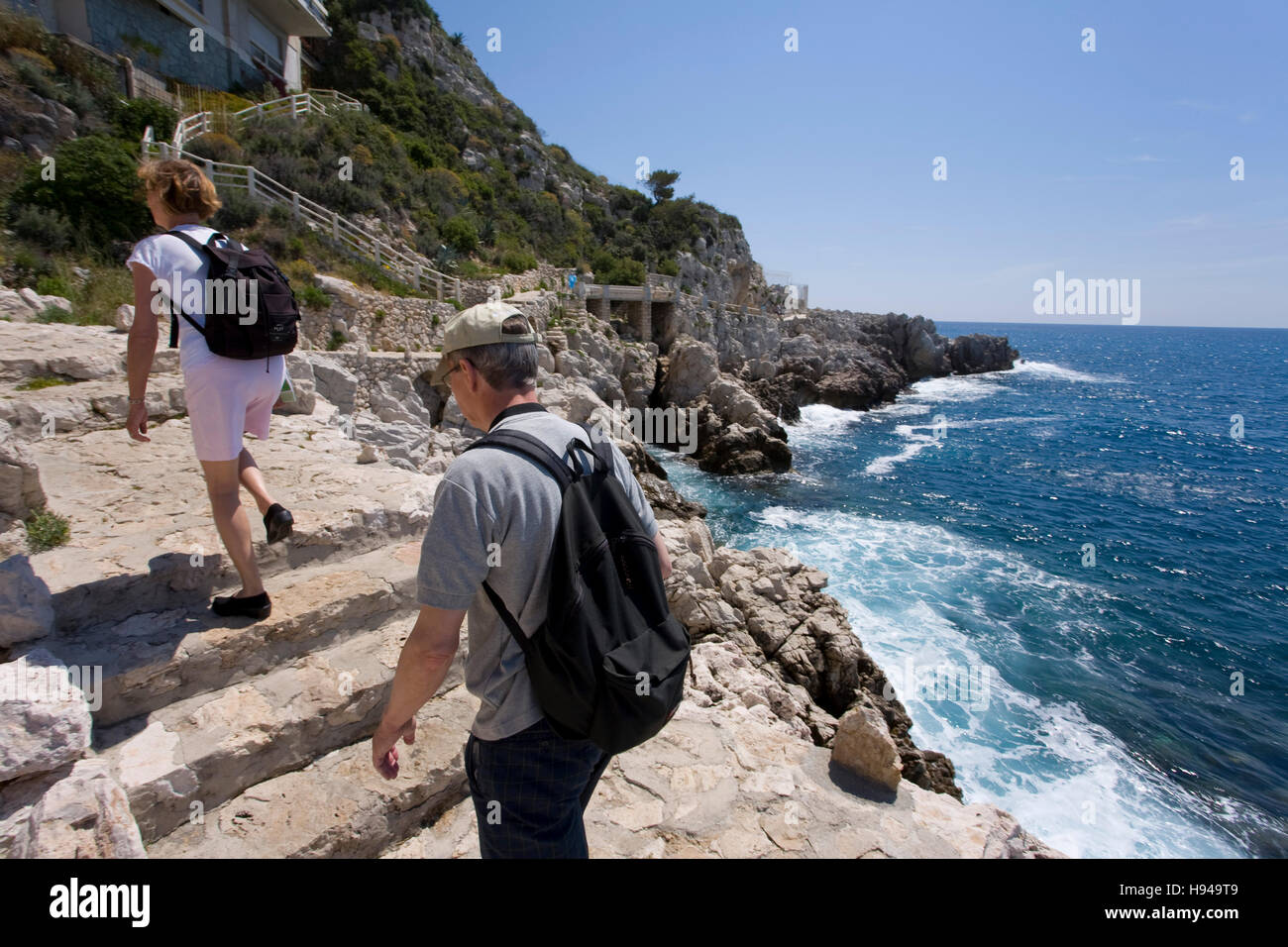 Pedestrians on the Sentier du Bord de Mer coastal path, Nice, Cote d ...