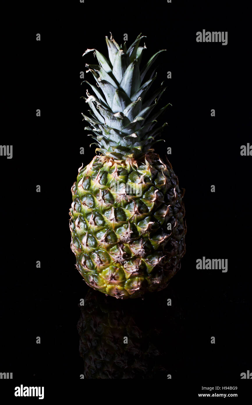 Pineapple with black background Stock Photo - Alamy