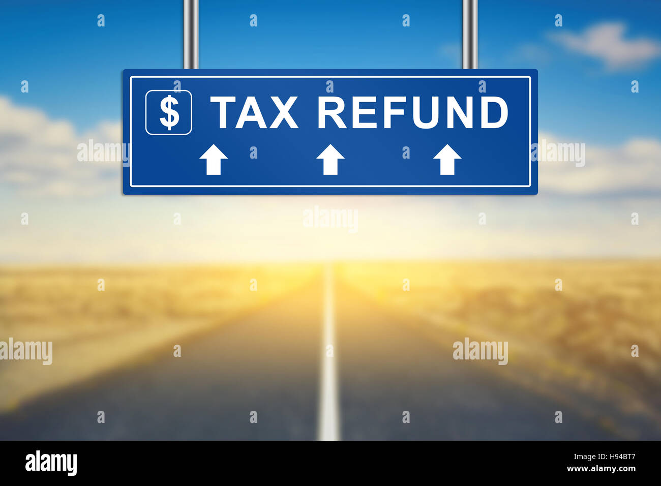 tax refund words on blue road sign with blurred background Stock Photo ...