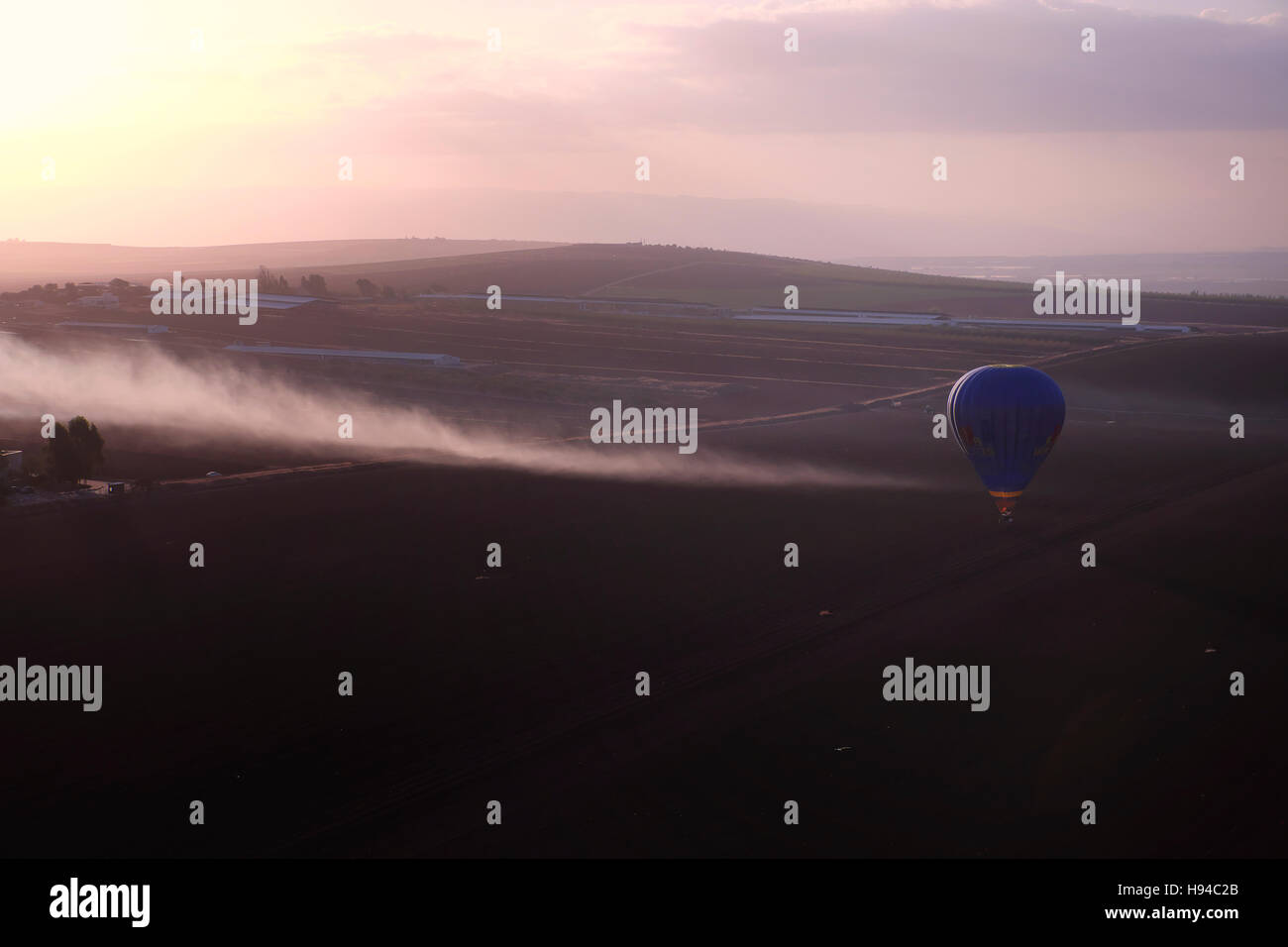 A hot air balloon hovering over agriculture fields in Jezreel Valley a ...