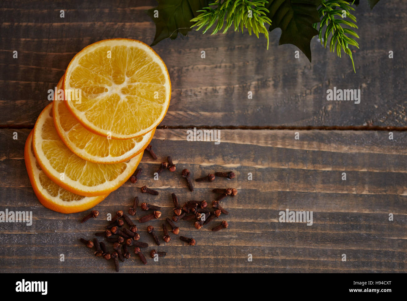 Lemon slices and cloves on wooden table Stock Photo - Alamy