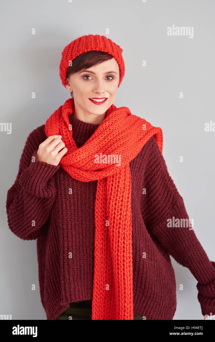 Attractive woman with red cap and scarf Stock Photo - Alamy