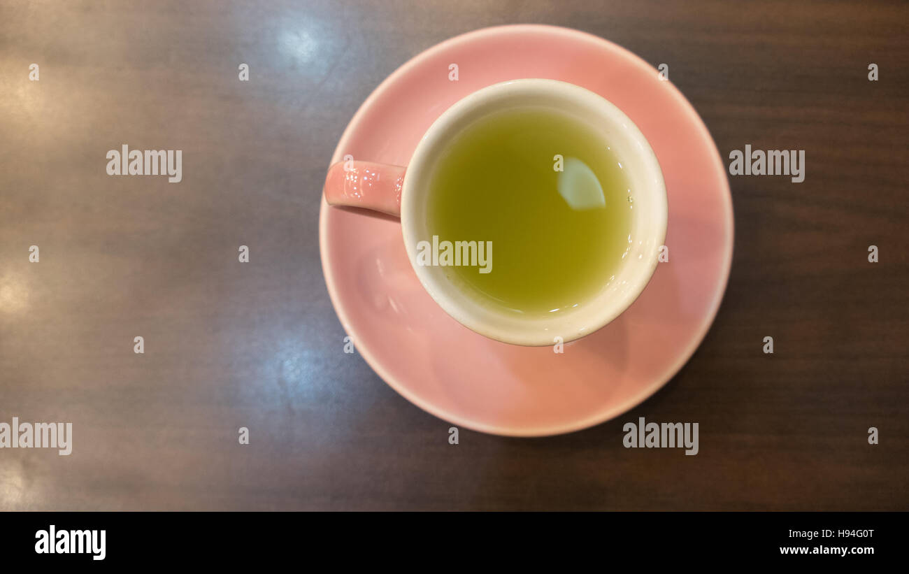 hot green tea in pink cup - top view Stock Photo - Alamy