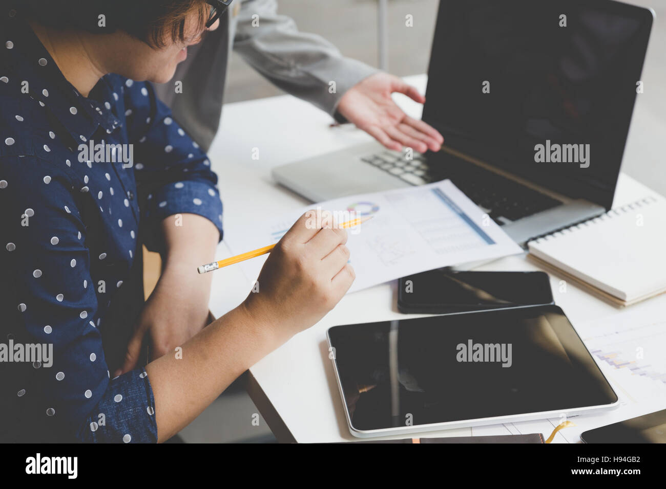 people working with document and laptop computer for use as office ...
