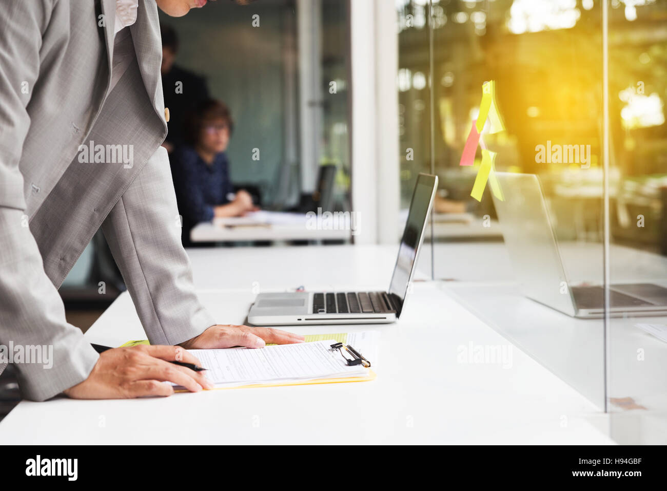 people working with document and laptop computer for use as office ...