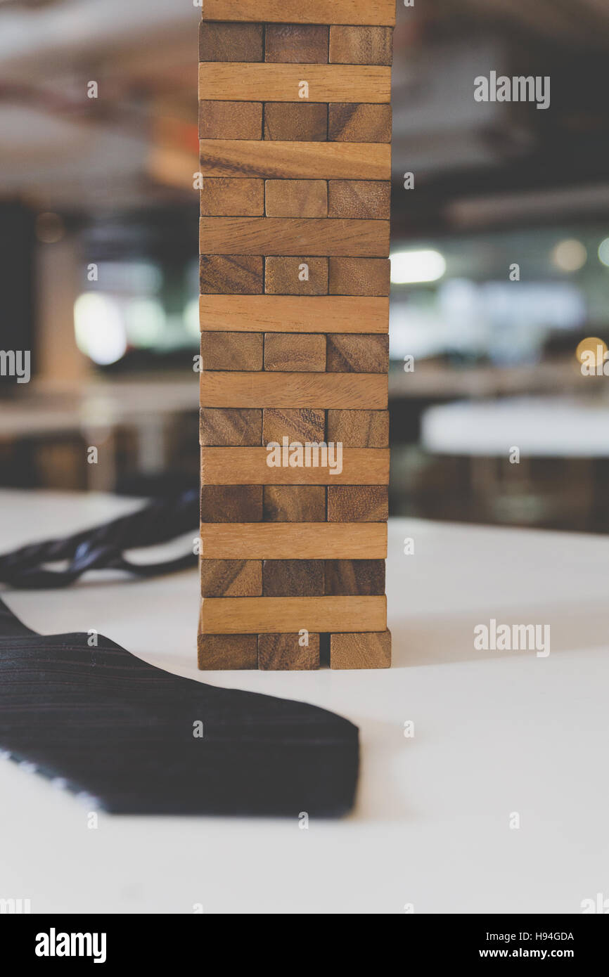 wood blocks stack game and neck tile on office desk Stock Photo - Alamy