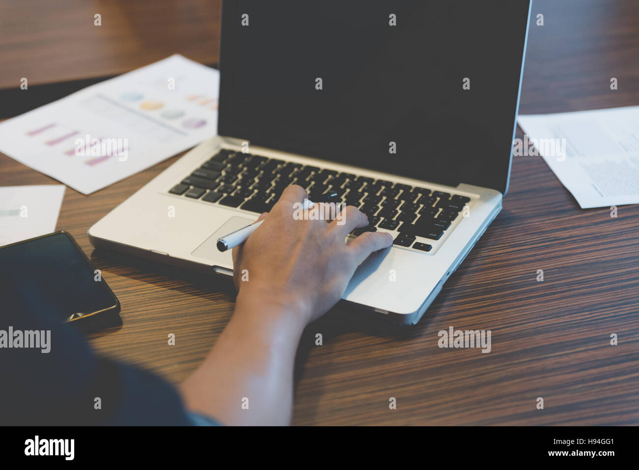 people working with document and laptop computer for use as office ...