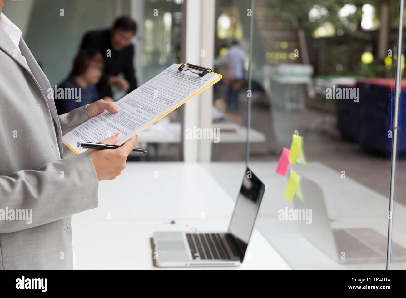people working with document and laptop computer for use as office ...