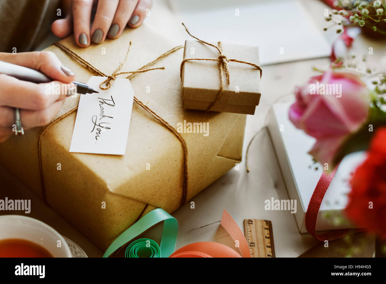 Woman writing birthday card hi-res stock photography and images - Alamy