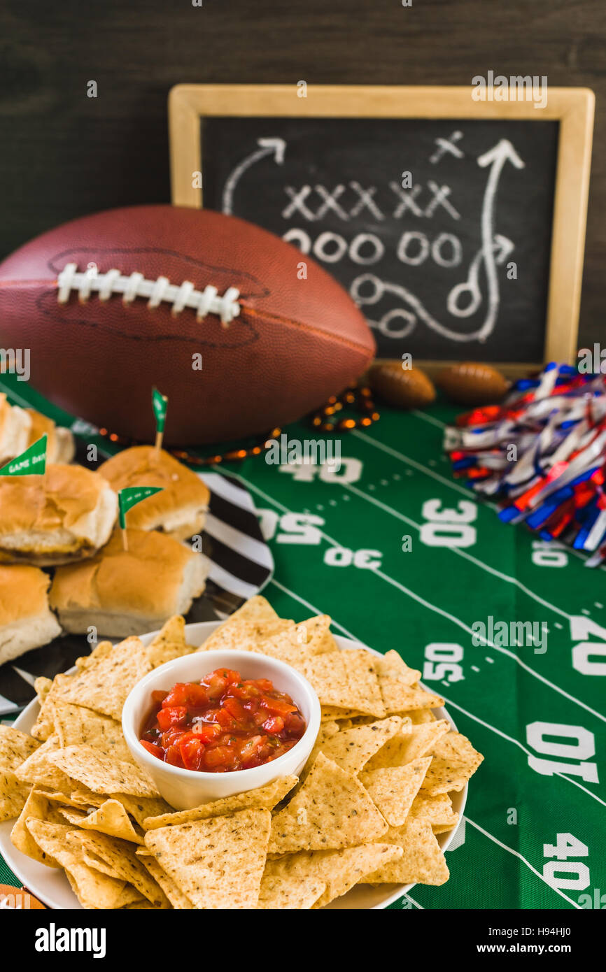Game day football party table with beer, chips and salsa Stock Photo ...
