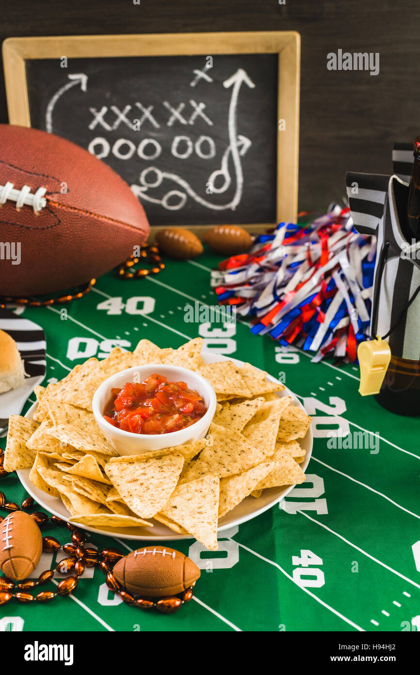 Game day football party table with beer, chips and salsa Stock Photo ...