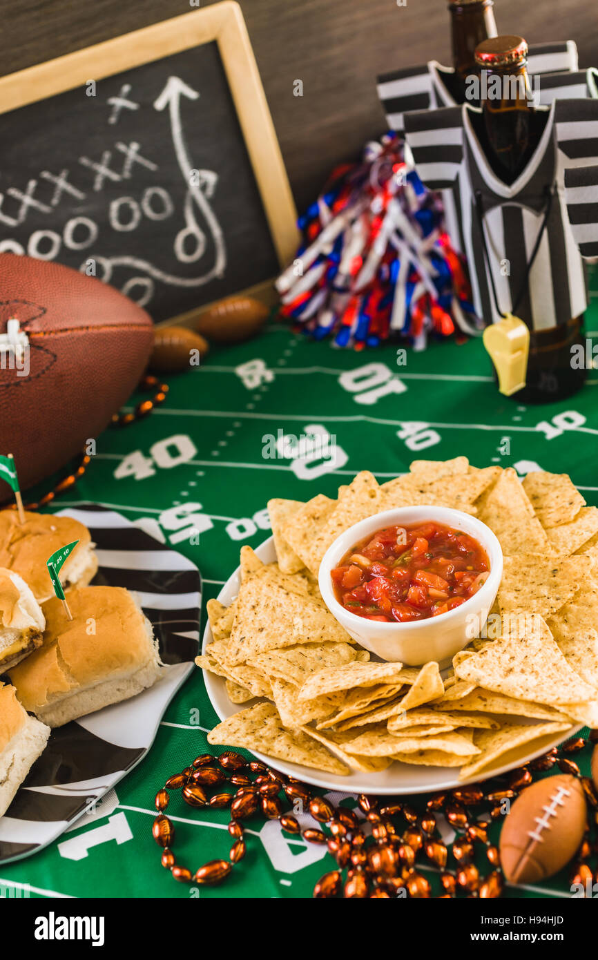 Game day football party table with beer, chips and salsa Stock Photo ...