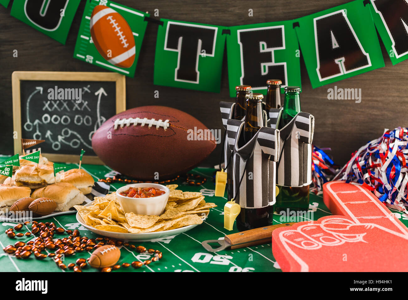 Game day football party table with beer, chips and salsa Stock Photo ...