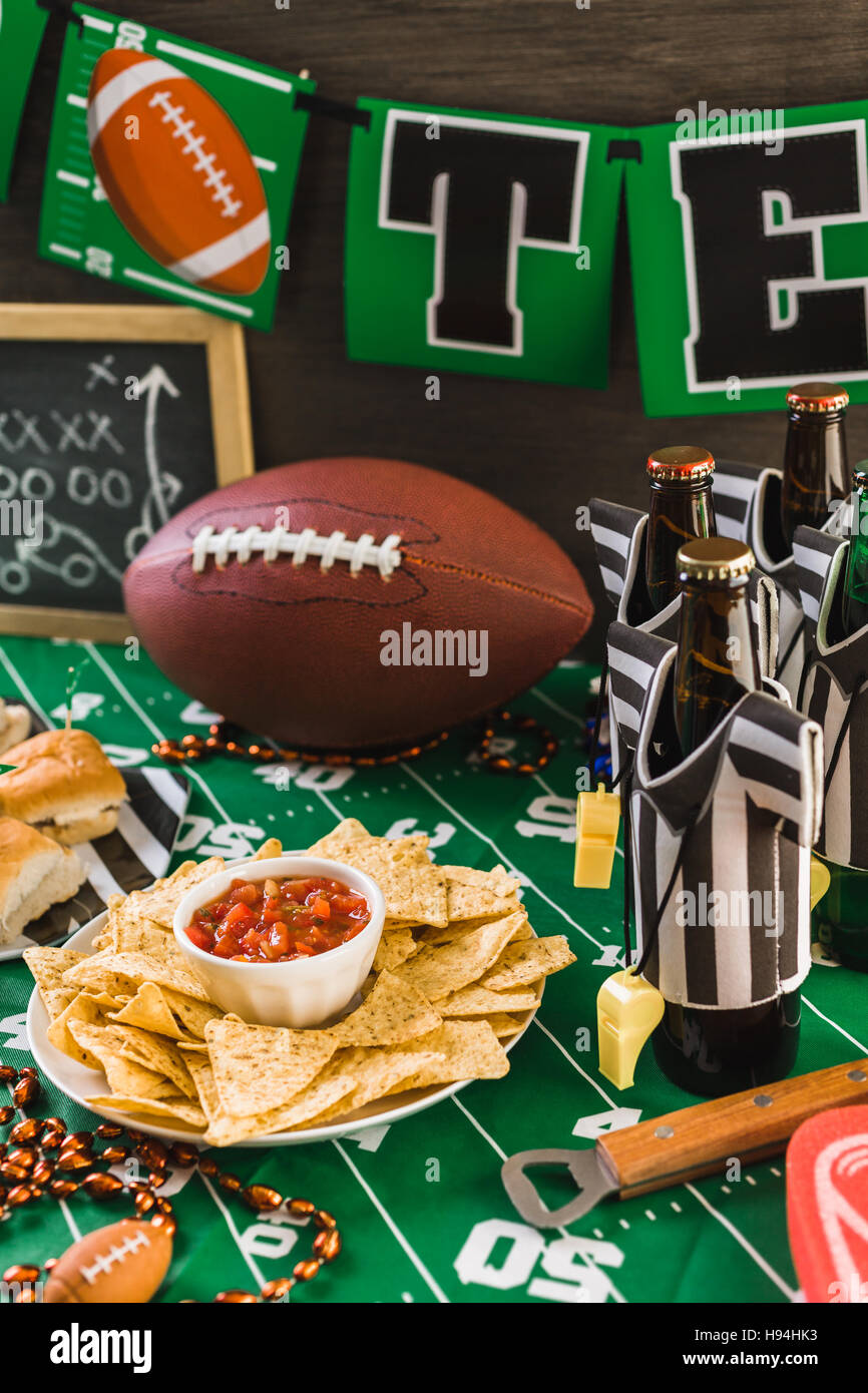 Game day football party table with beer, chips and salsa Stock Photo ...