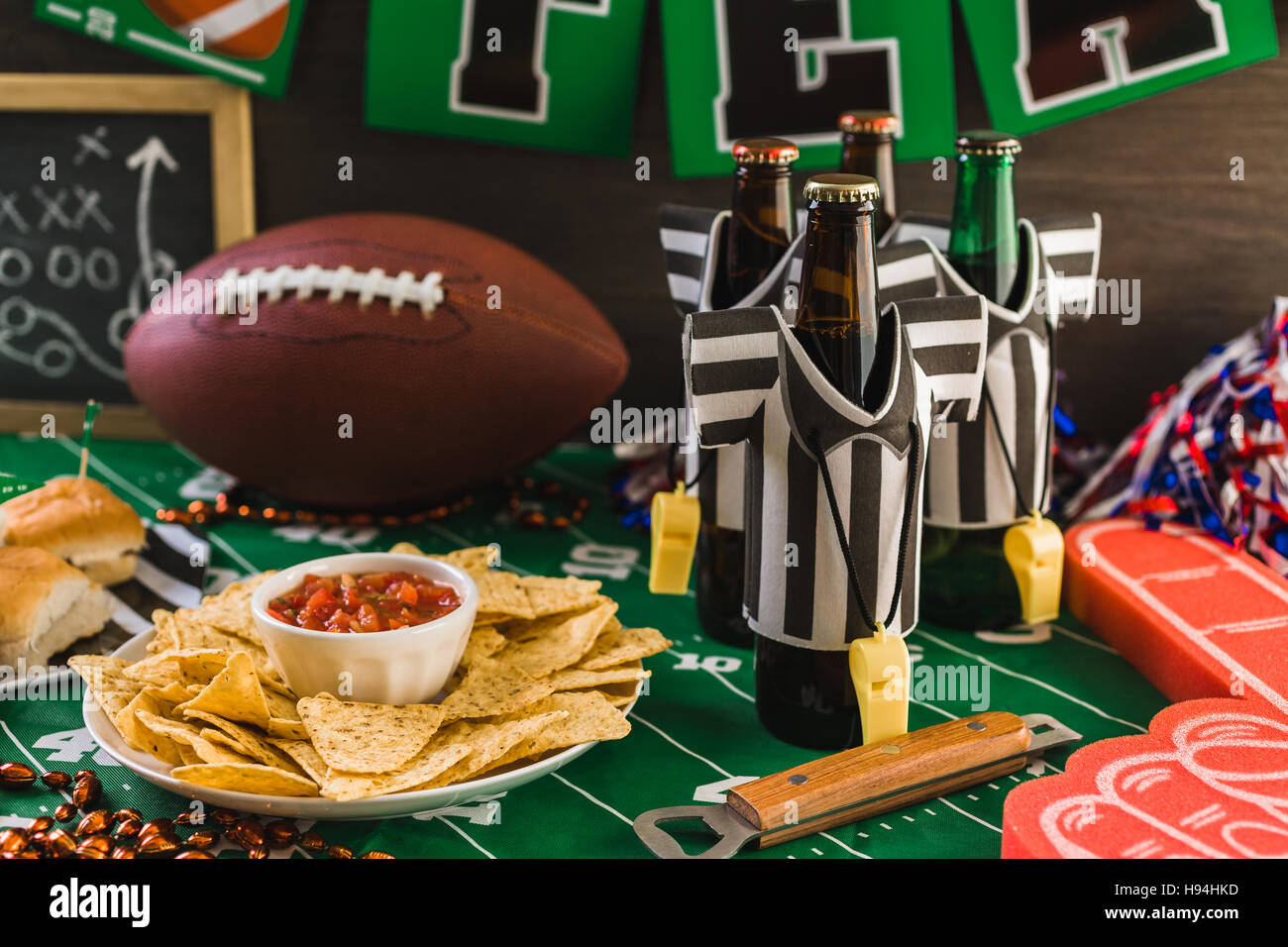 Game day football party table with beer, chips and salsa Stock Photo ...