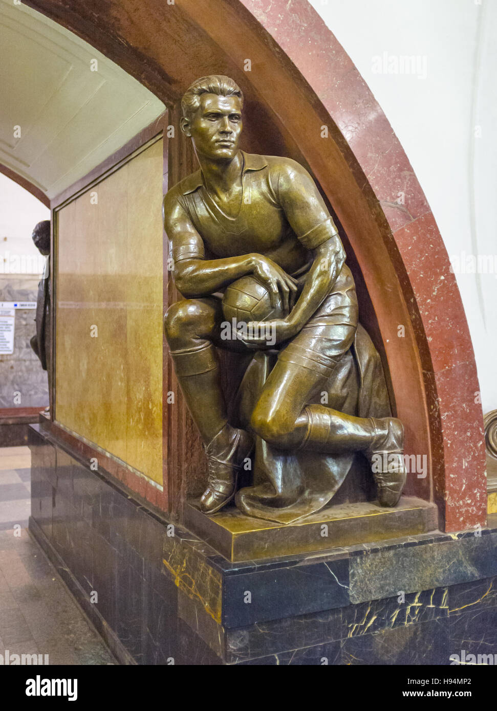 The bronze sculpture of a football player in Revolution Square Metro ...