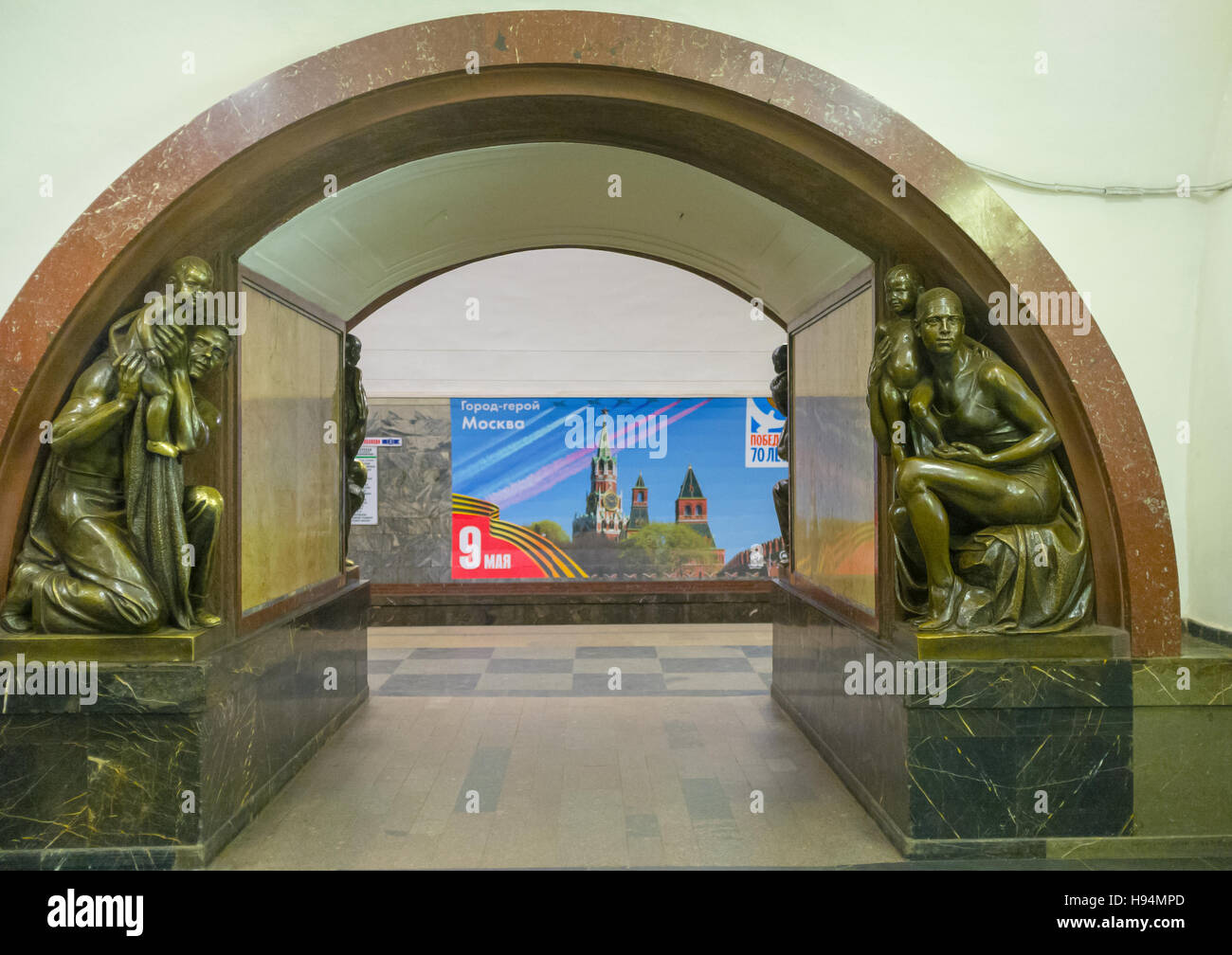 The bronze sculptures on each side of the marble arch in Revolution ...