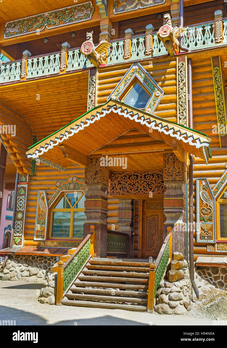 The wooden porch of the Tsar's Palace with the colorful carved patterns ...