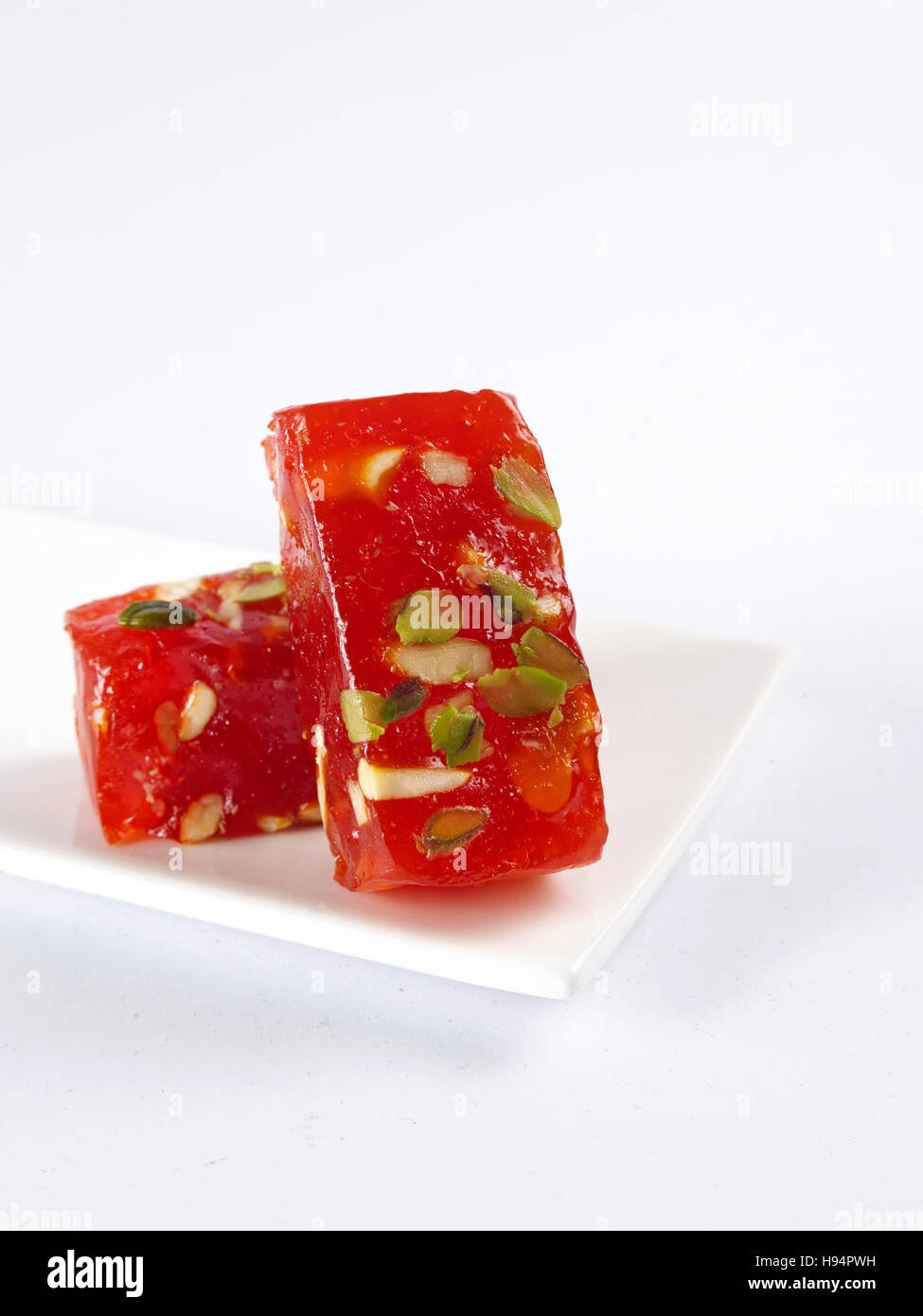 HALWA SERVED IN A WHITE PLATTER ON WHITE BACKGROUND Stock Photo - Alamy