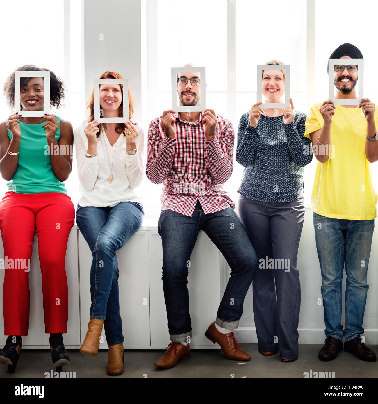 Diversity Hipster Friends Frame Holding Concept Stock Photo - Alamy