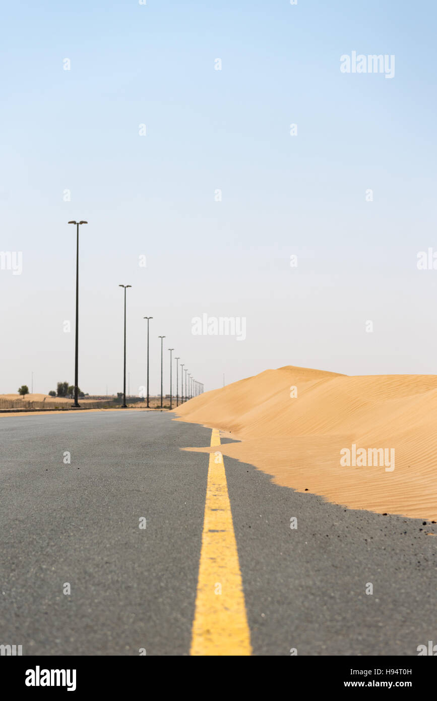 Road in desert blocked by sand dune Stock Photo - Alamy