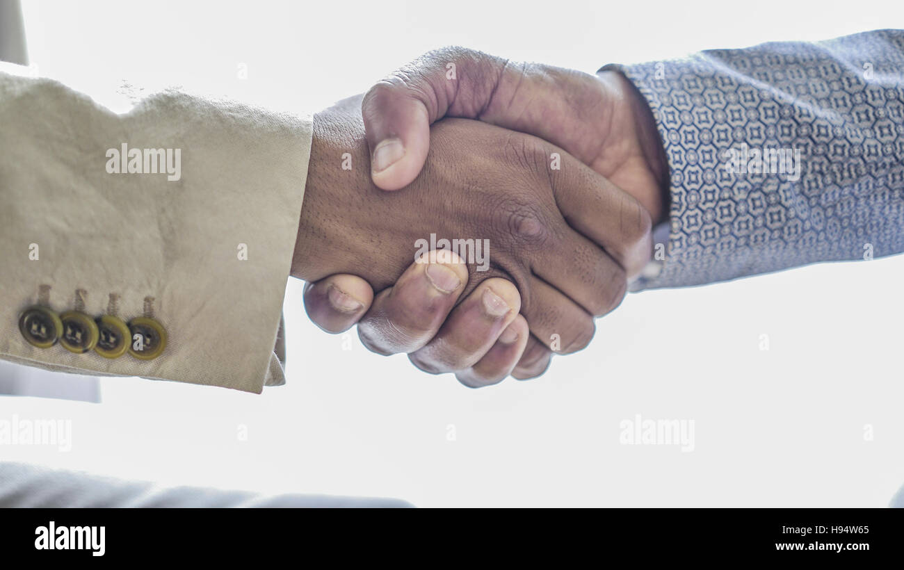 African handshake hi-res stock photography and images - Alamy