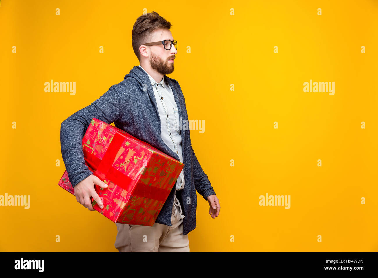Male holding big present box Stock Photo - Alamy