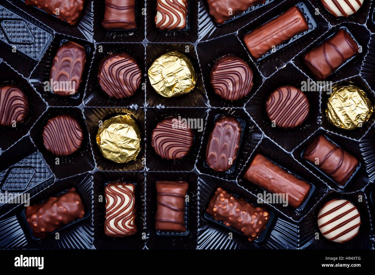 Close up shot of chocolates in box Stock Photo - Alamy