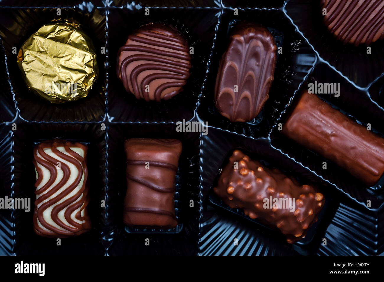 Chocolates in box foil square hi-res stock photography and images - Alamy