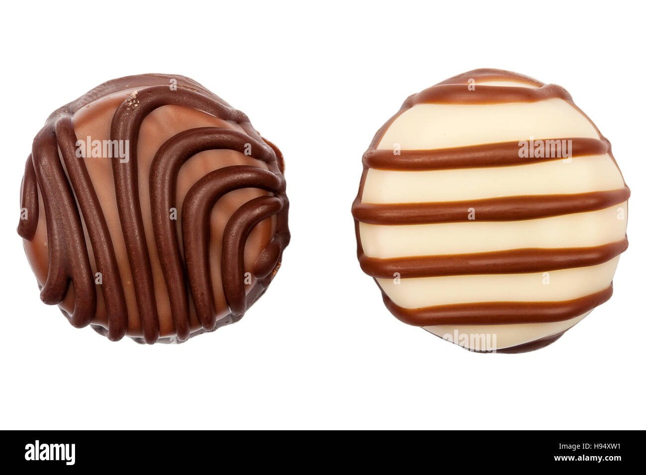 Two chocolate candies isolated on white background Stock Photo - Alamy