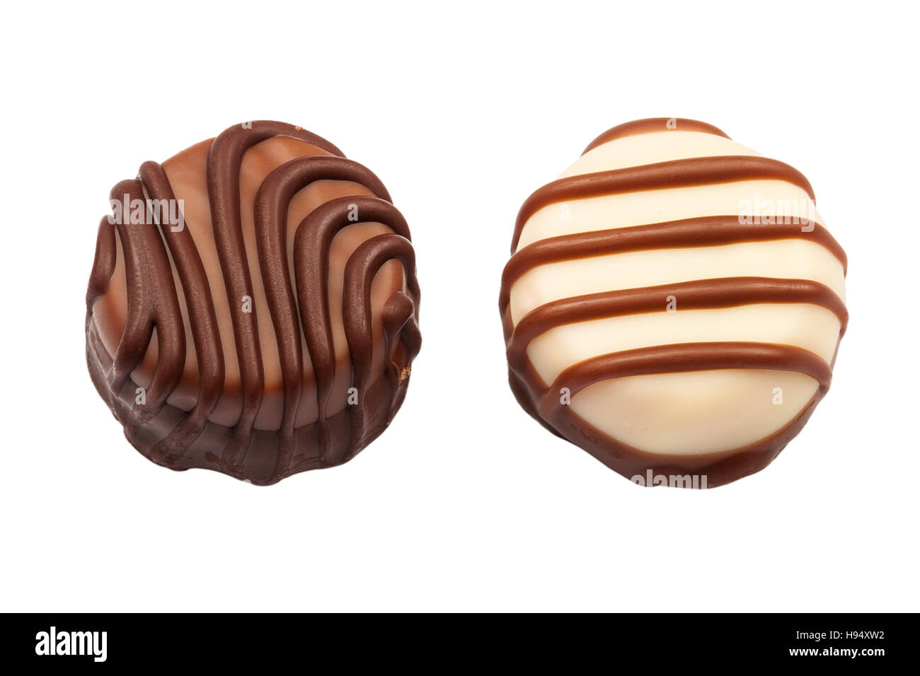 Two chocolate candies isolated on white background Stock Photo - Alamy